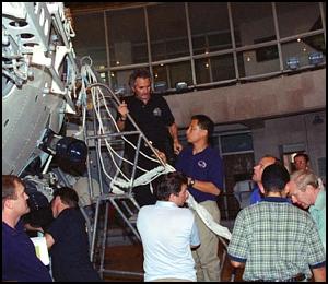 The old crew (left) and the new STS-101 crew (right).