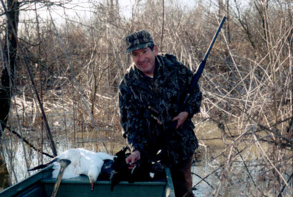 Charles Rabb of A.G. Edwards with a banded wood duck.