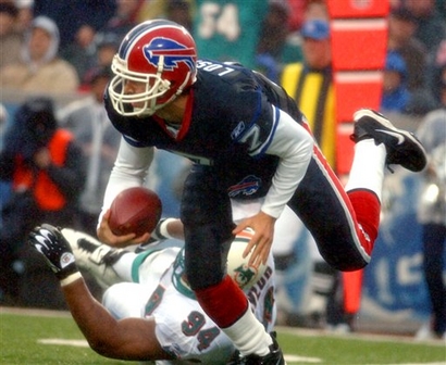 Bills quarterback J.P. Losman manages to escape being sacked by Miami ...
