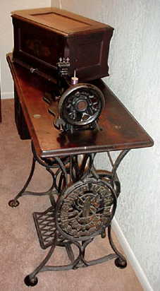 This is the end panel of the stand. Notice that the Singer emblem is ...