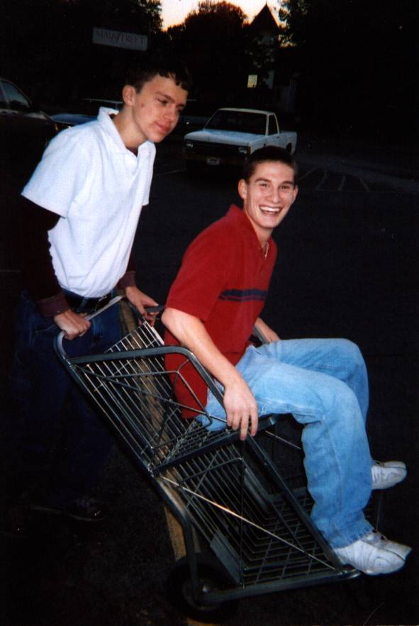 J Goody looks on in shame as The Beast enjoys a ride on a carryout cart.
