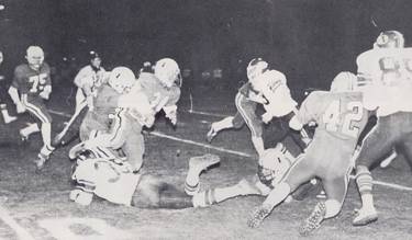 Warrior sensation running back Mark Ricker #34 gets some blocking help ...