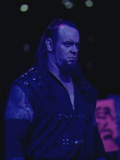 Finally, the Undertaker breaks the silence, and asks for a mic. He gets ...