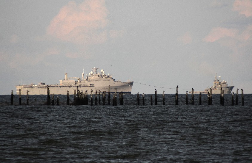 Here and above, USS Nashville LPD-13, under tow by the USNS Apache T ...