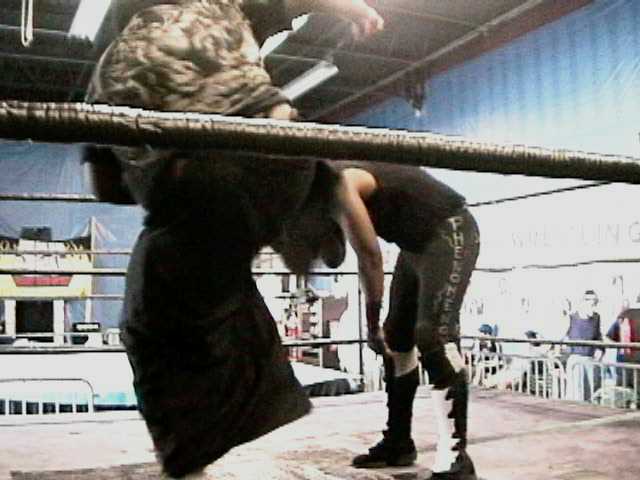 Devon Devious posing in blue wrestling gear before a UWA show.